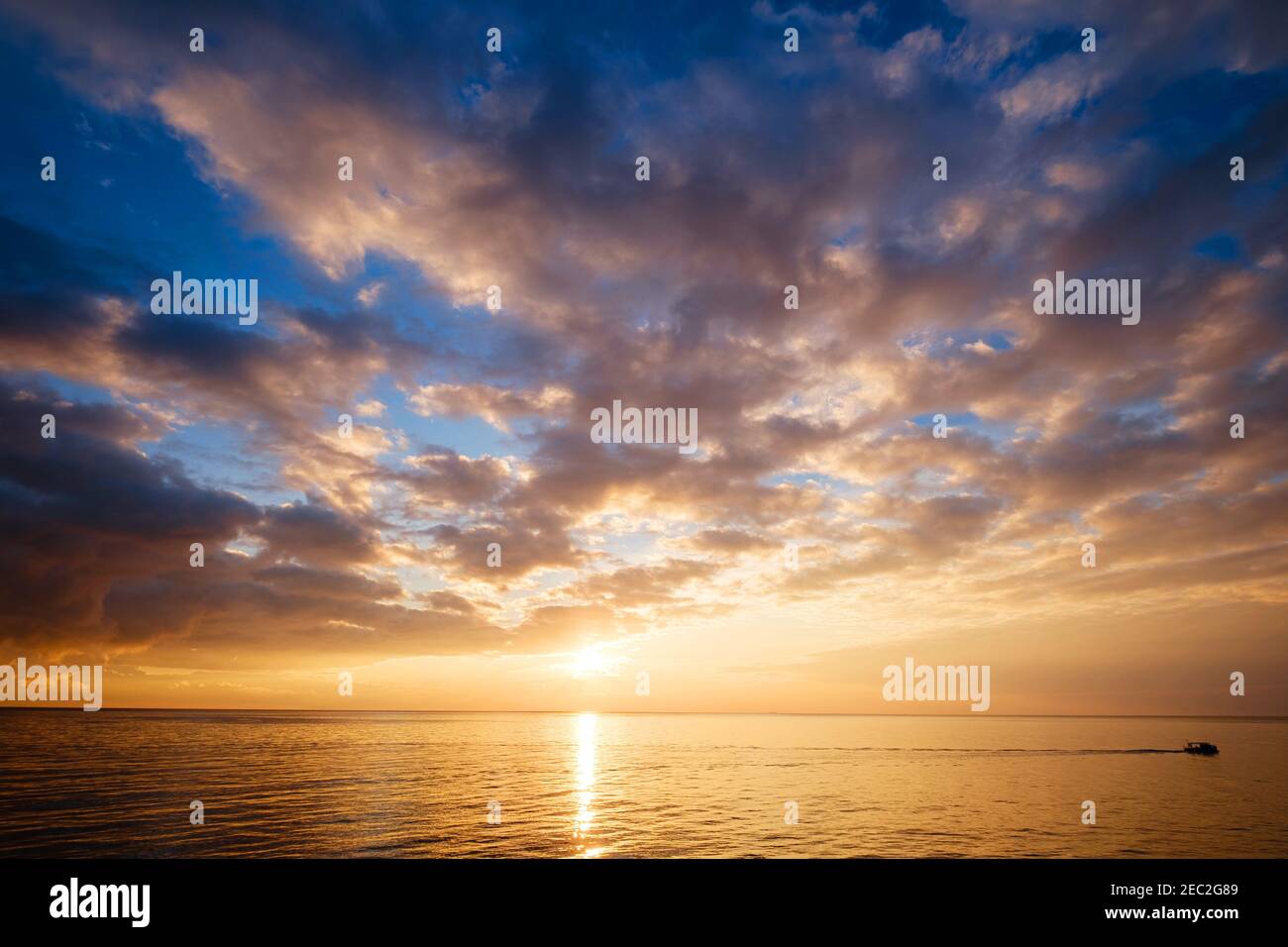 Calm sea with sunset sky and sun through the clouds over. Meditation ...