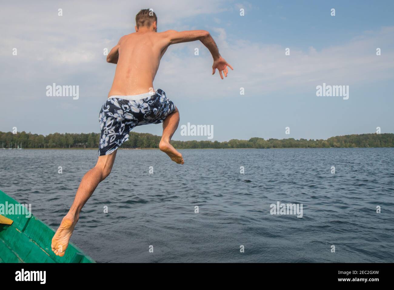 Boy jumping boat hi-res stock photography and images - Alamy