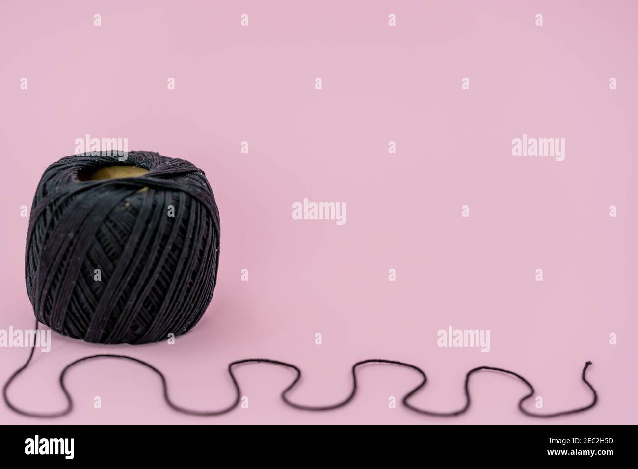 Black ball thread. A ball of black braided small robe, made from ...