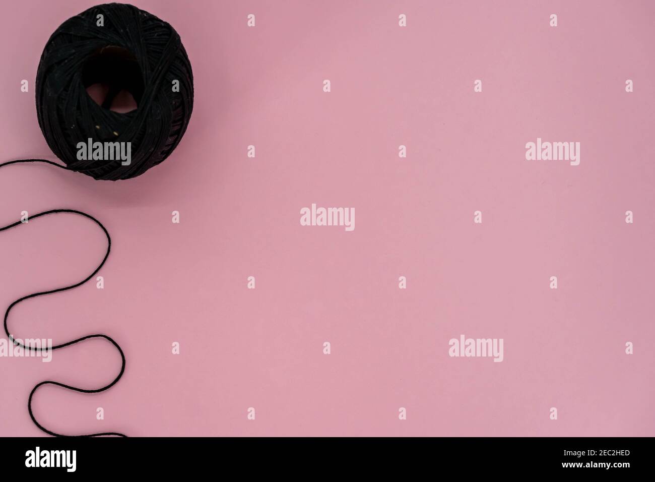 Black ball thread. A ball of black braided small robe, made from ...