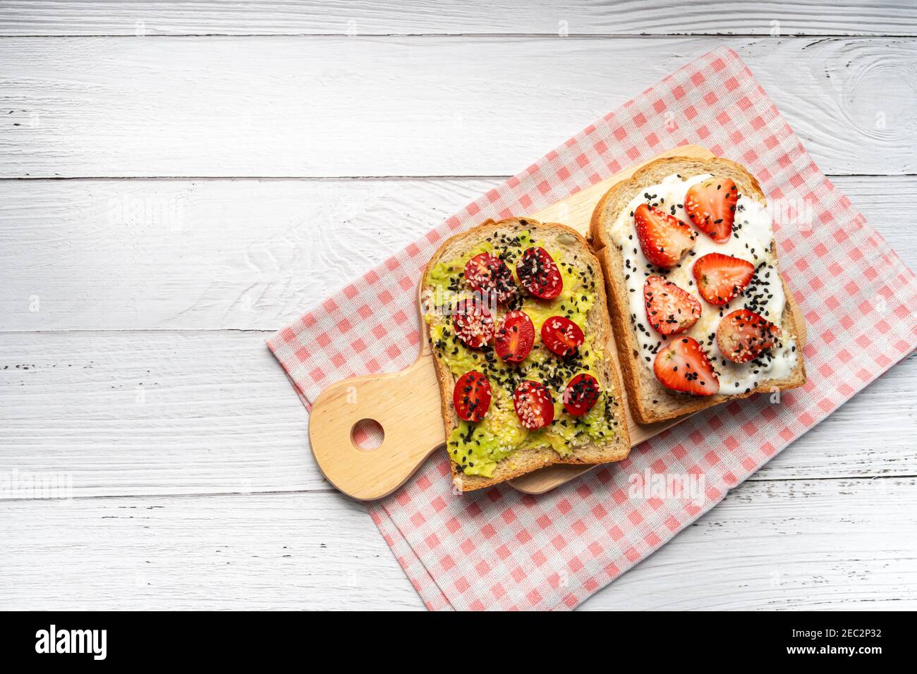 Healthy breakfast toasts with Avocado toast, tomato, strawberry ...