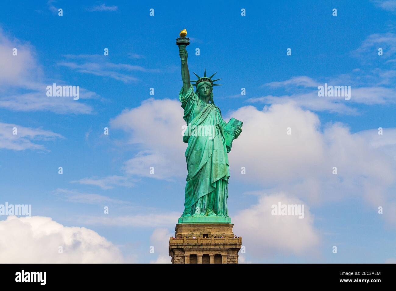 The front view of the Statue of Liberty on blue sky backgrond on a ...