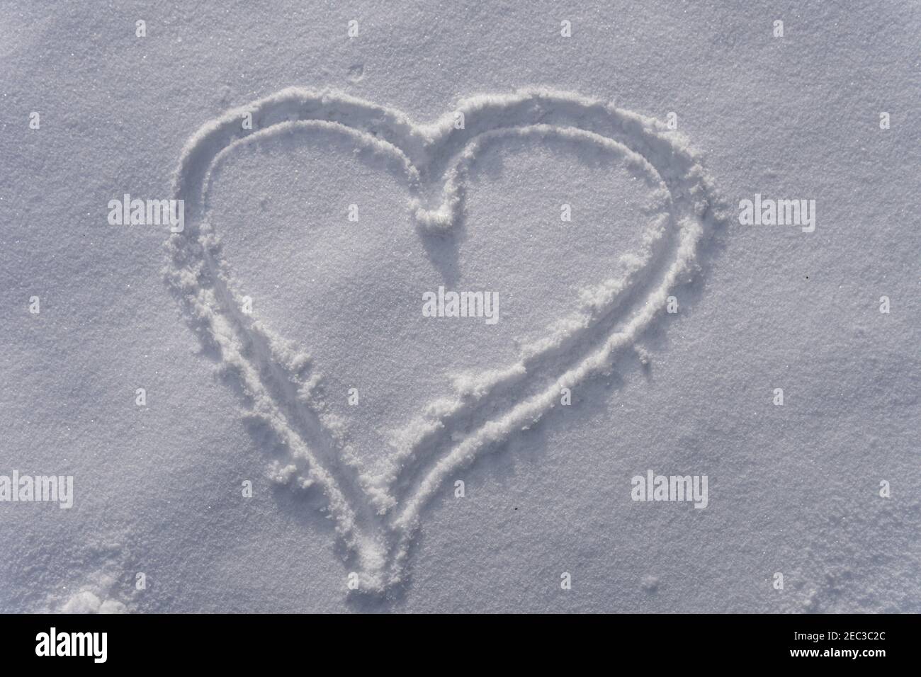 Love heart drawn on snow hi-res stock photography and images - Alamy