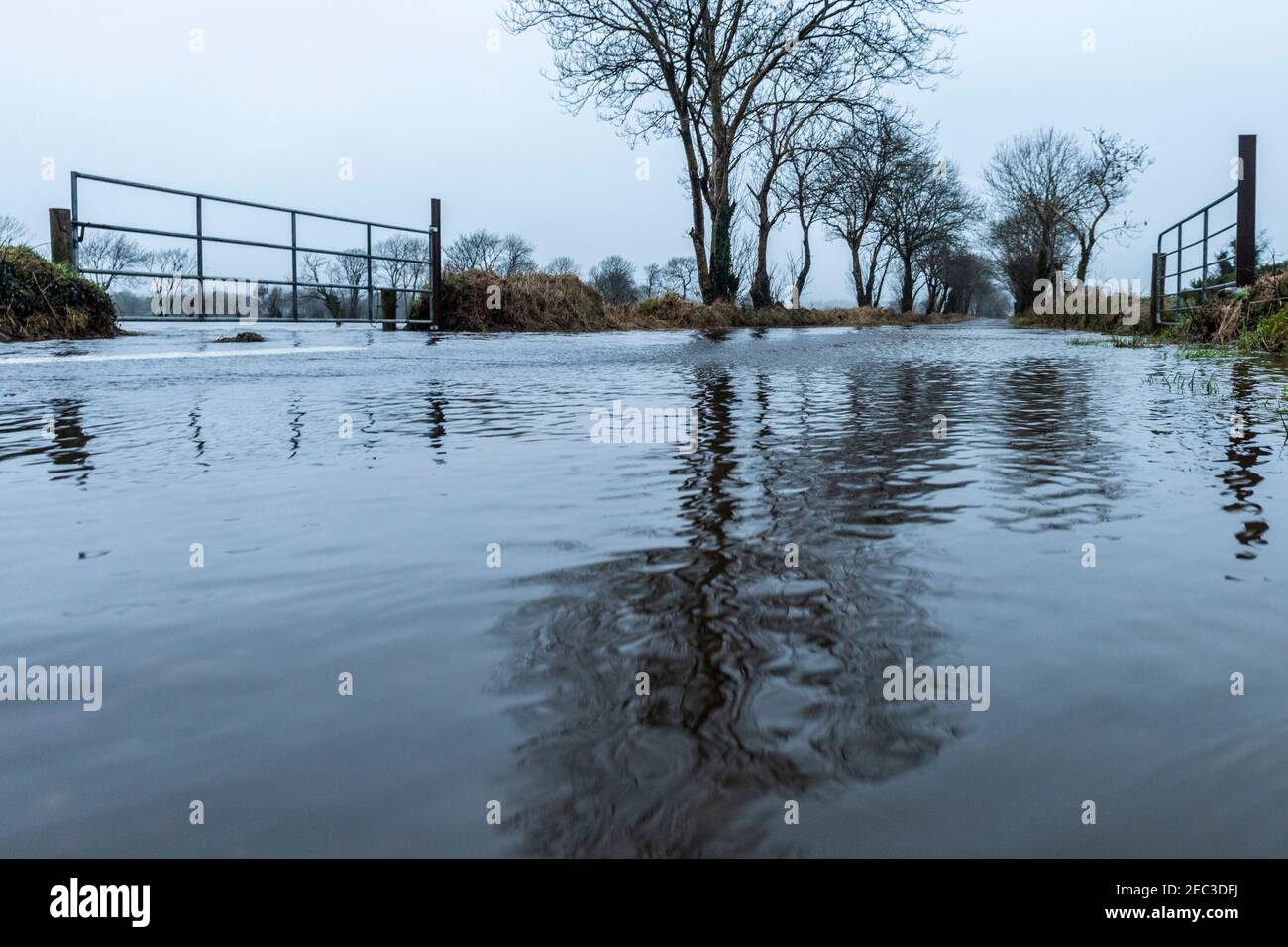 River burst banks flooding road hi-res stock photography and images - Alamy