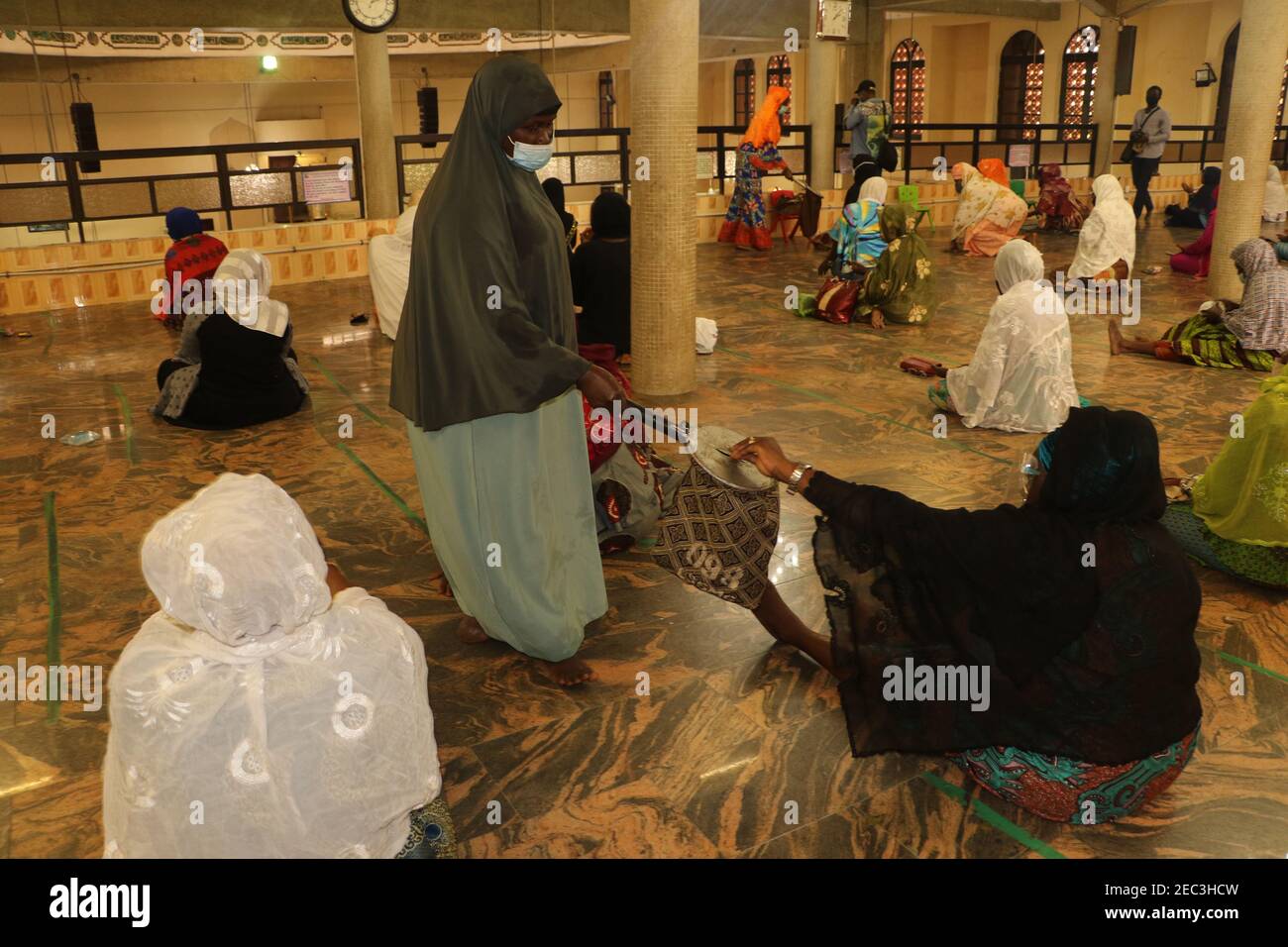 Muslim faithful wearing facemasks and maintained social distance as ...