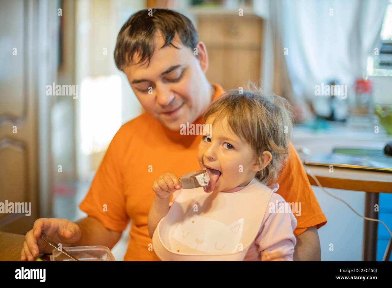 Girl eating popsicle ice cream hi-res stock photography and images - Alamy