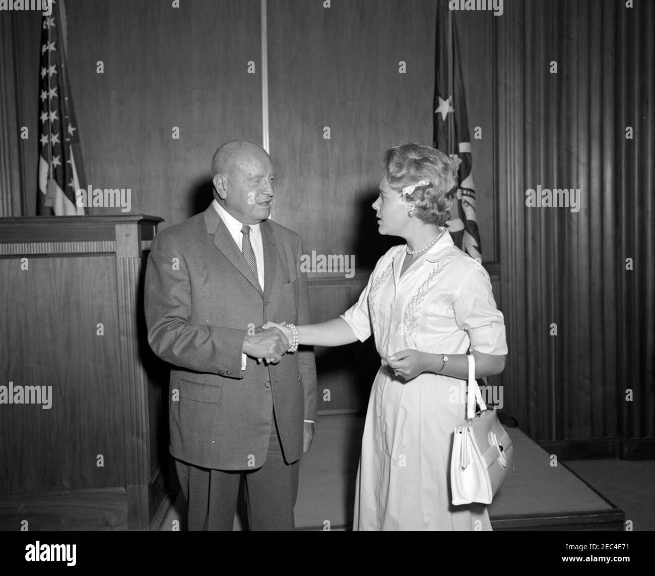 Shakes hands with an unidentified guest Black and White Stock Photos ...