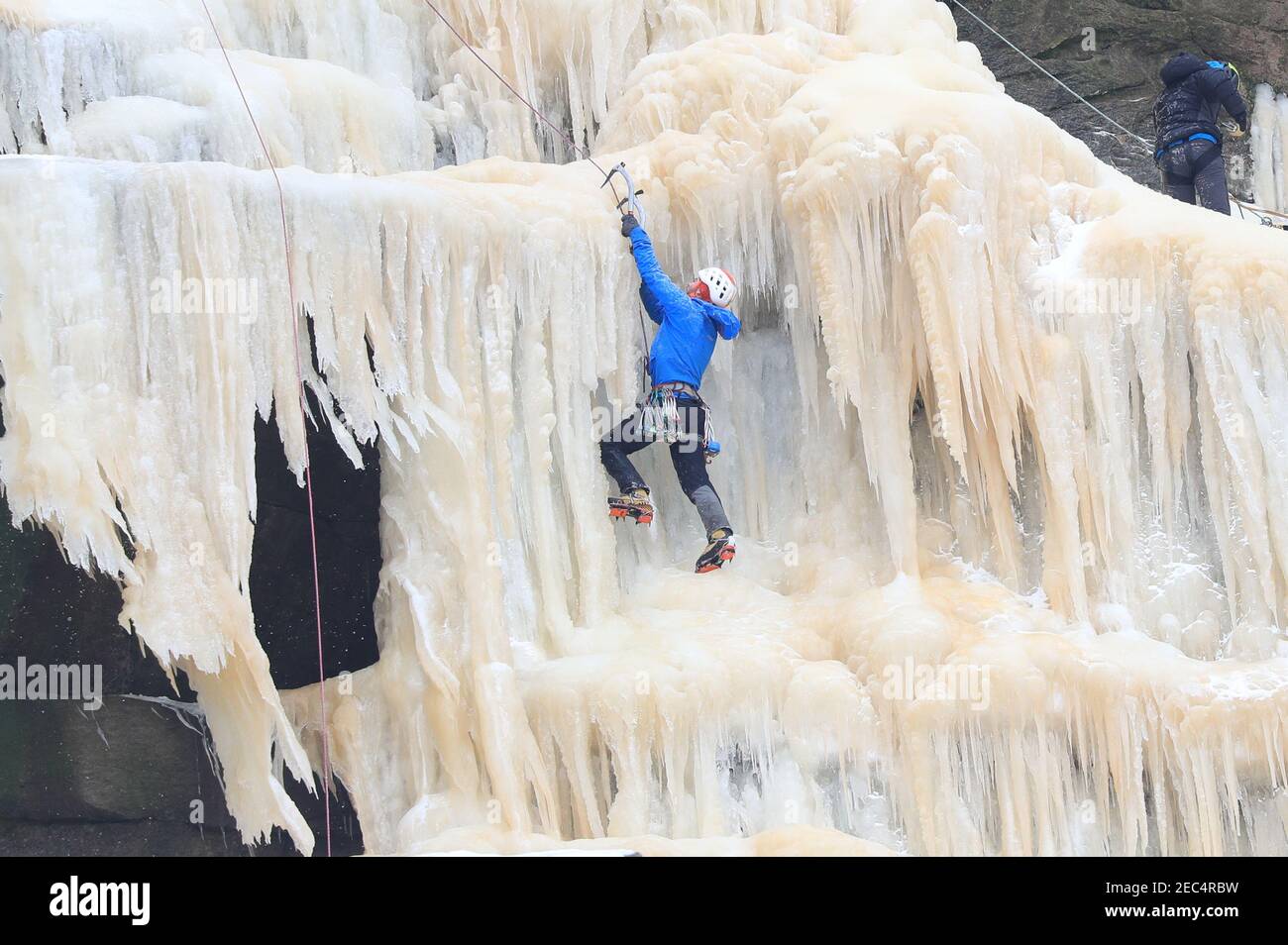 People ice climb on the frozen Kinder Downfall, High Peak in Derbyshire ...