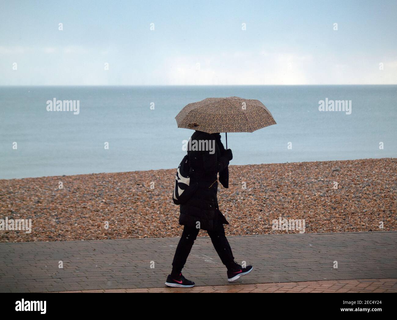 Taking a walk along the Brighton seafront Stock Photo - Alamy