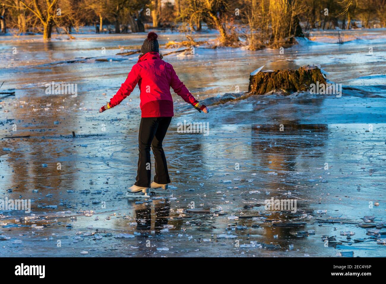 ice skaters on frozen field Stock Photo - Alamy
