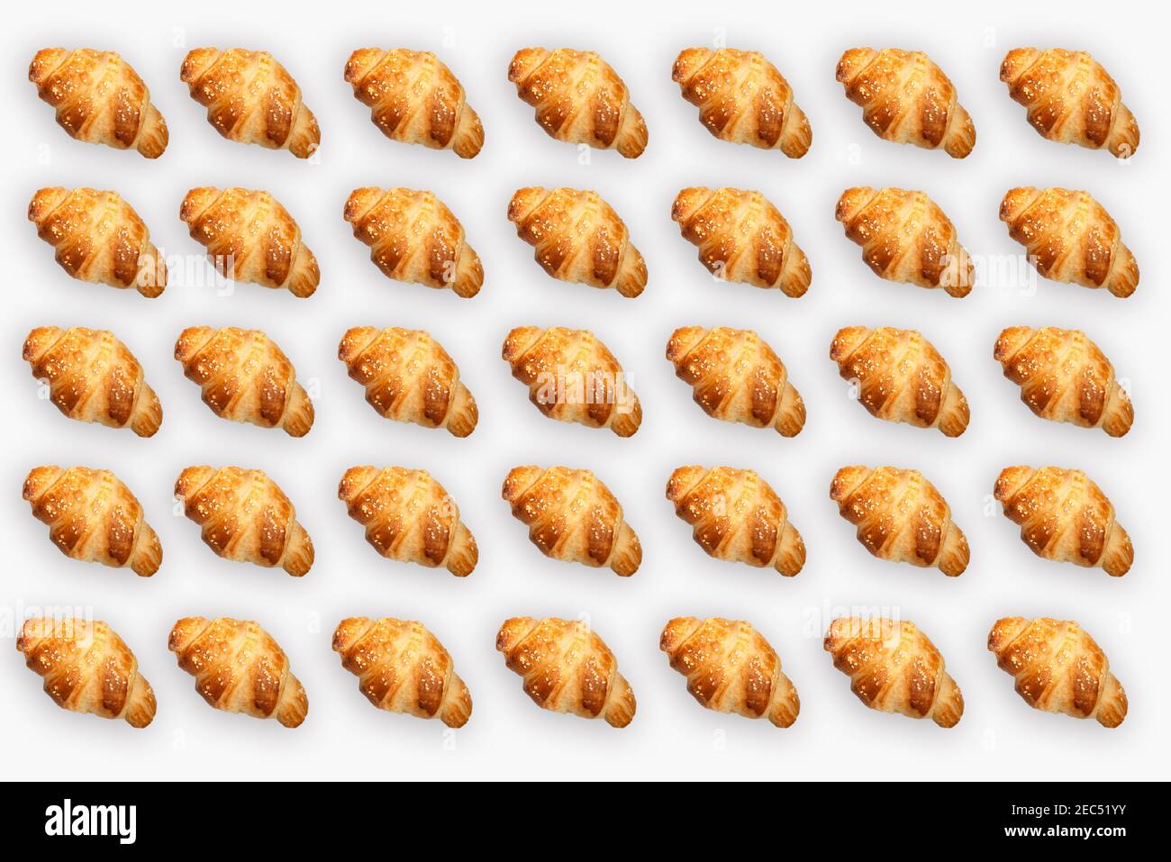 Pattern French croissant on a light background Stock Photo - Alamy