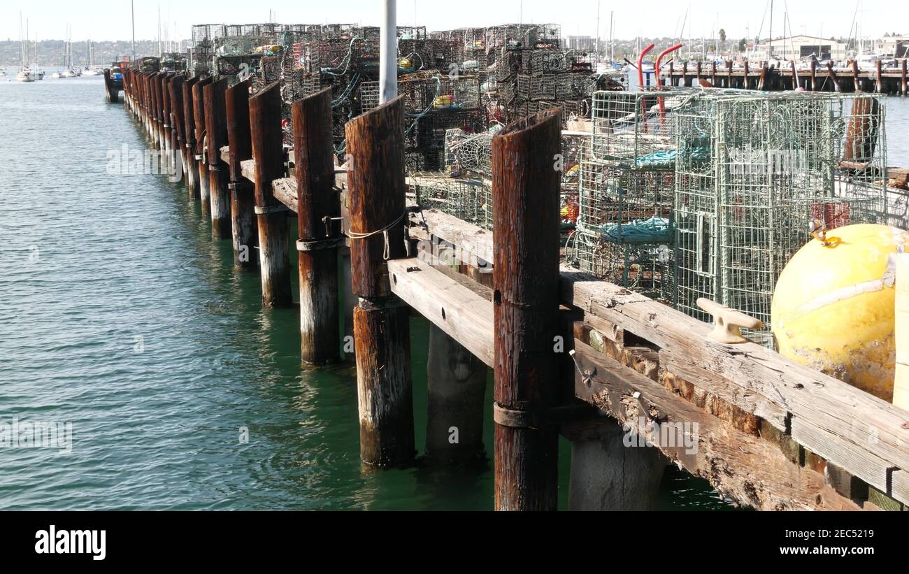 Traps, ropes and cages on pier, commercial dock, fishing industry in ...
