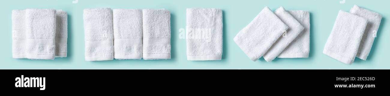 Set of white spa towels on light blue background, top view Stock Photo ...