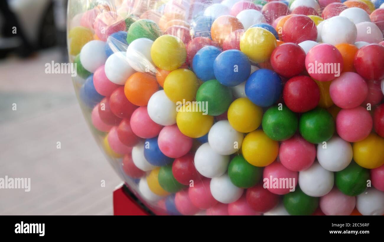 Colorful gumballs in classic vending machine, USA. Multi colored buble ...