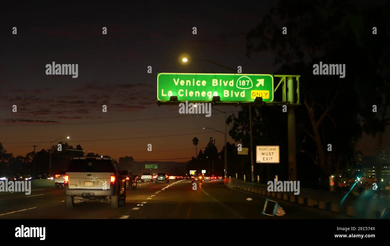 View from the car. Los Angeles busy freeway at night time. Massive ...