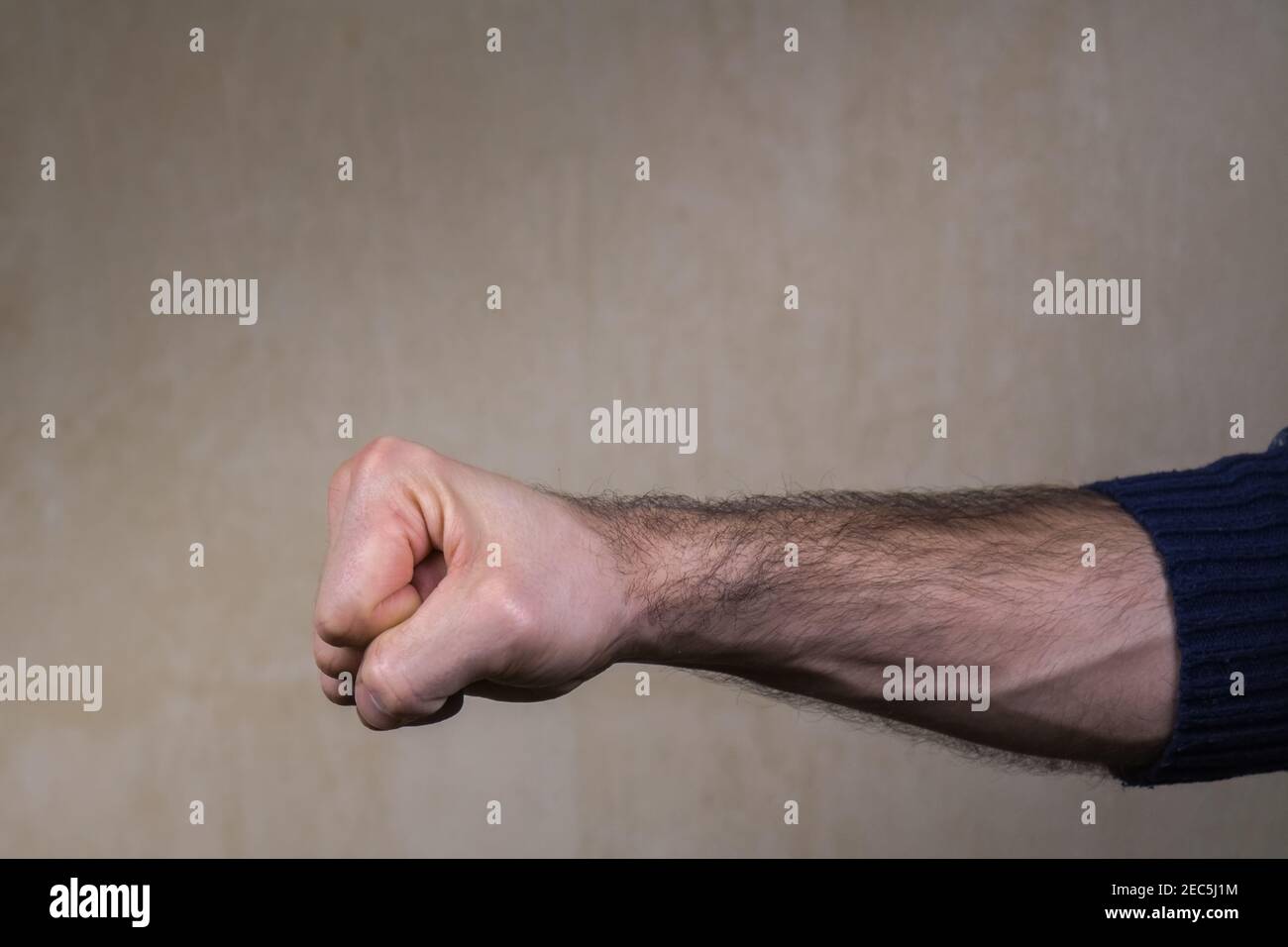 Man's fist clenched in anger. Domestic or gender violence concept Stock ...