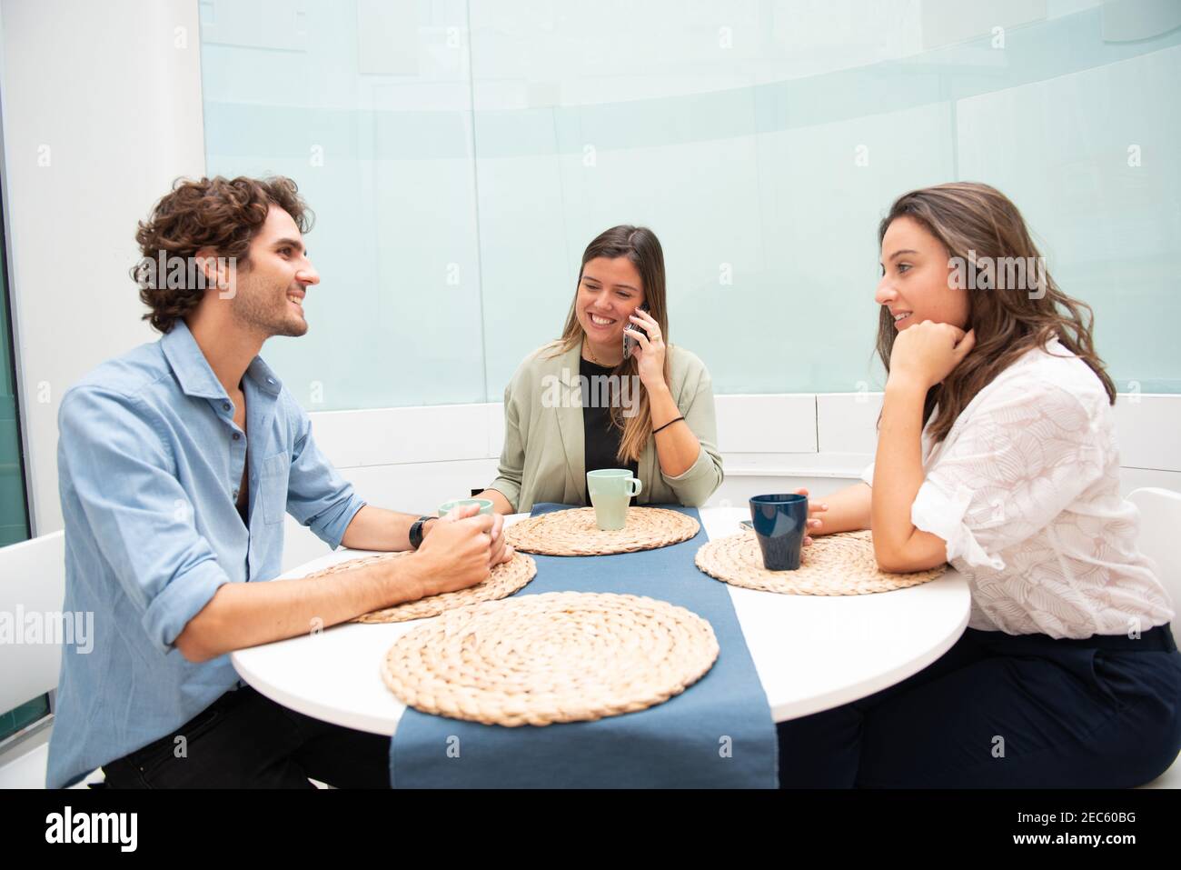 young people at work having a coffee in their free time Stock Photo - Alamy