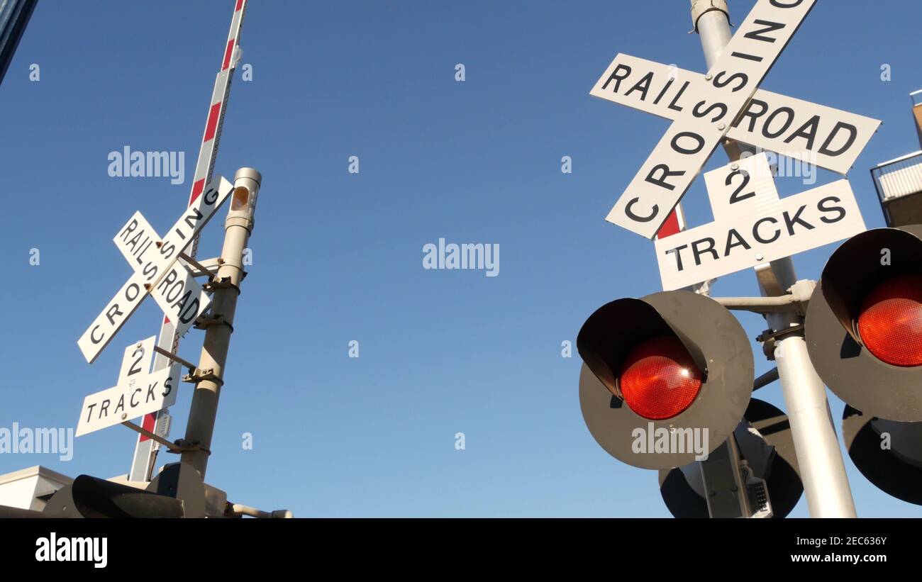 Level crossing warning signal in USA. Crossbuck notice and red traffic ...