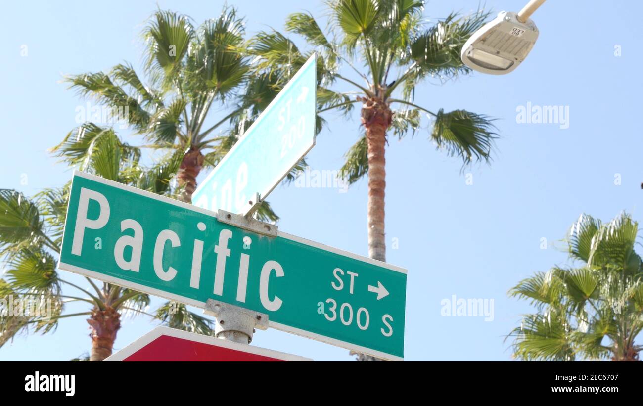 Pacific street road sign on crossroad, route 101 tourist destination ...