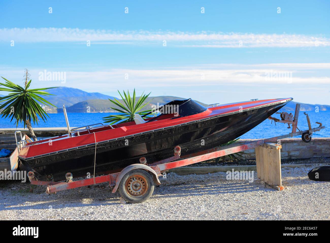 Motor boat on the boat trailer in the harbor Stock Photo - Alamy