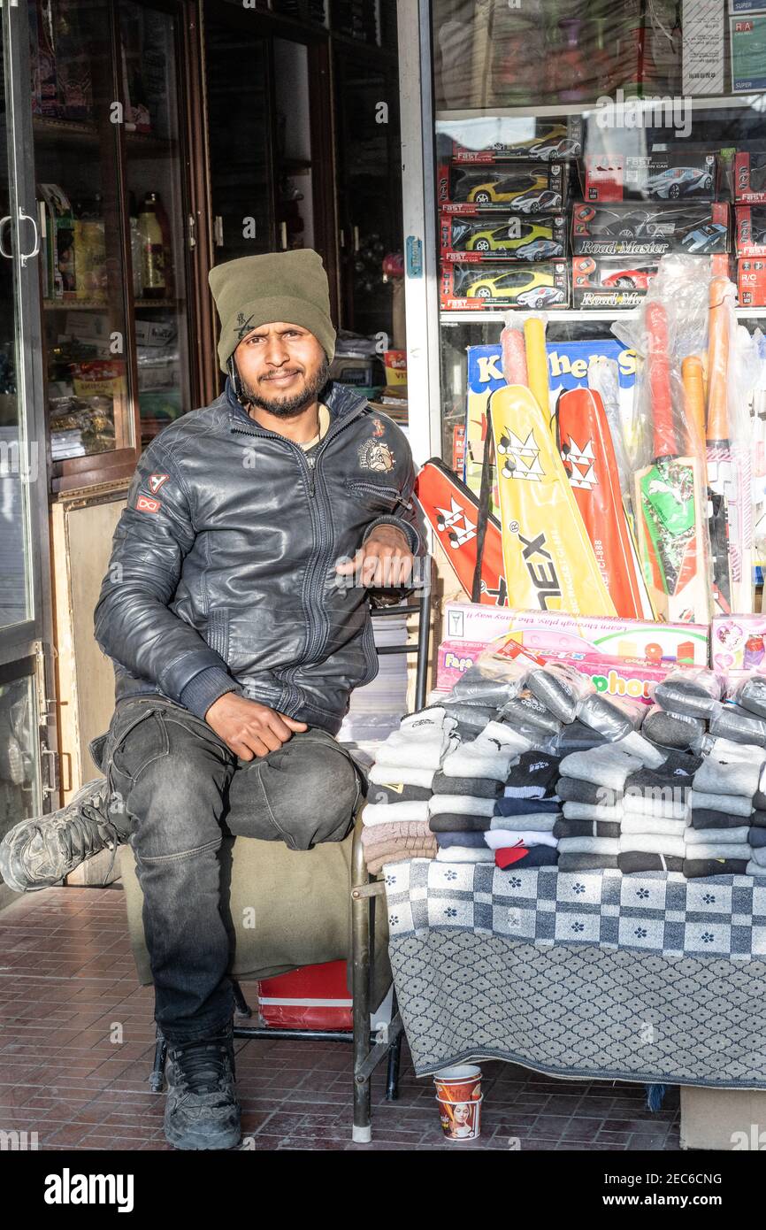 Shopkeeper goods sale in shop hi-res stock photography and images - Alamy