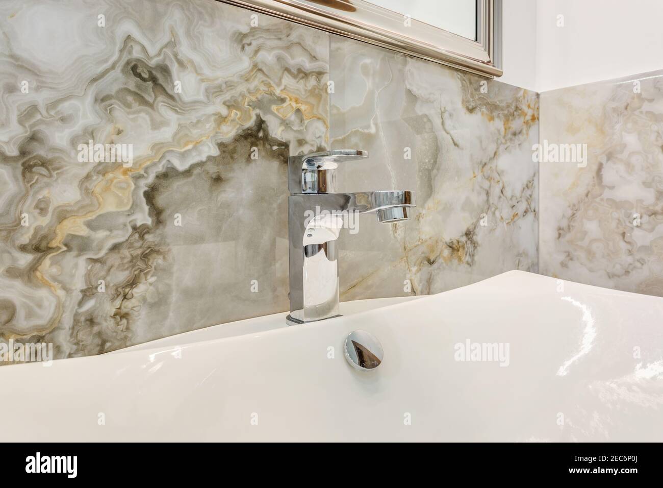 metal water tap sink with faucet in expensive bathroom Stock Photo - Alamy