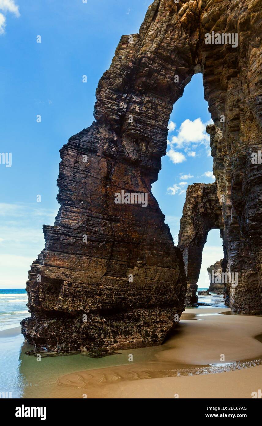 Natural rock arches on Cathedrals beach in low tide (Cantabric coast ...