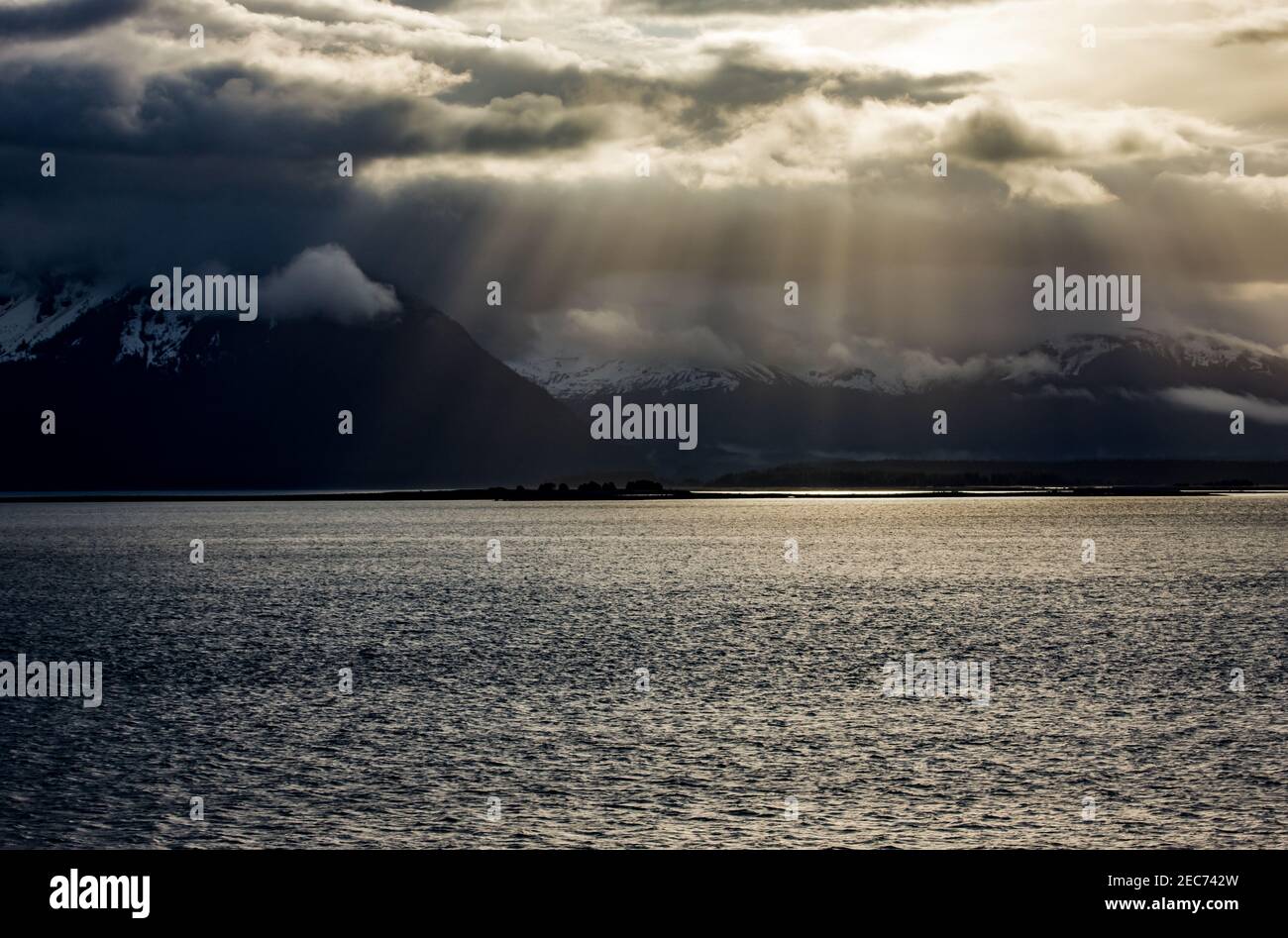 Multiple Sun Rays at Sea Stock Photo - Alamy