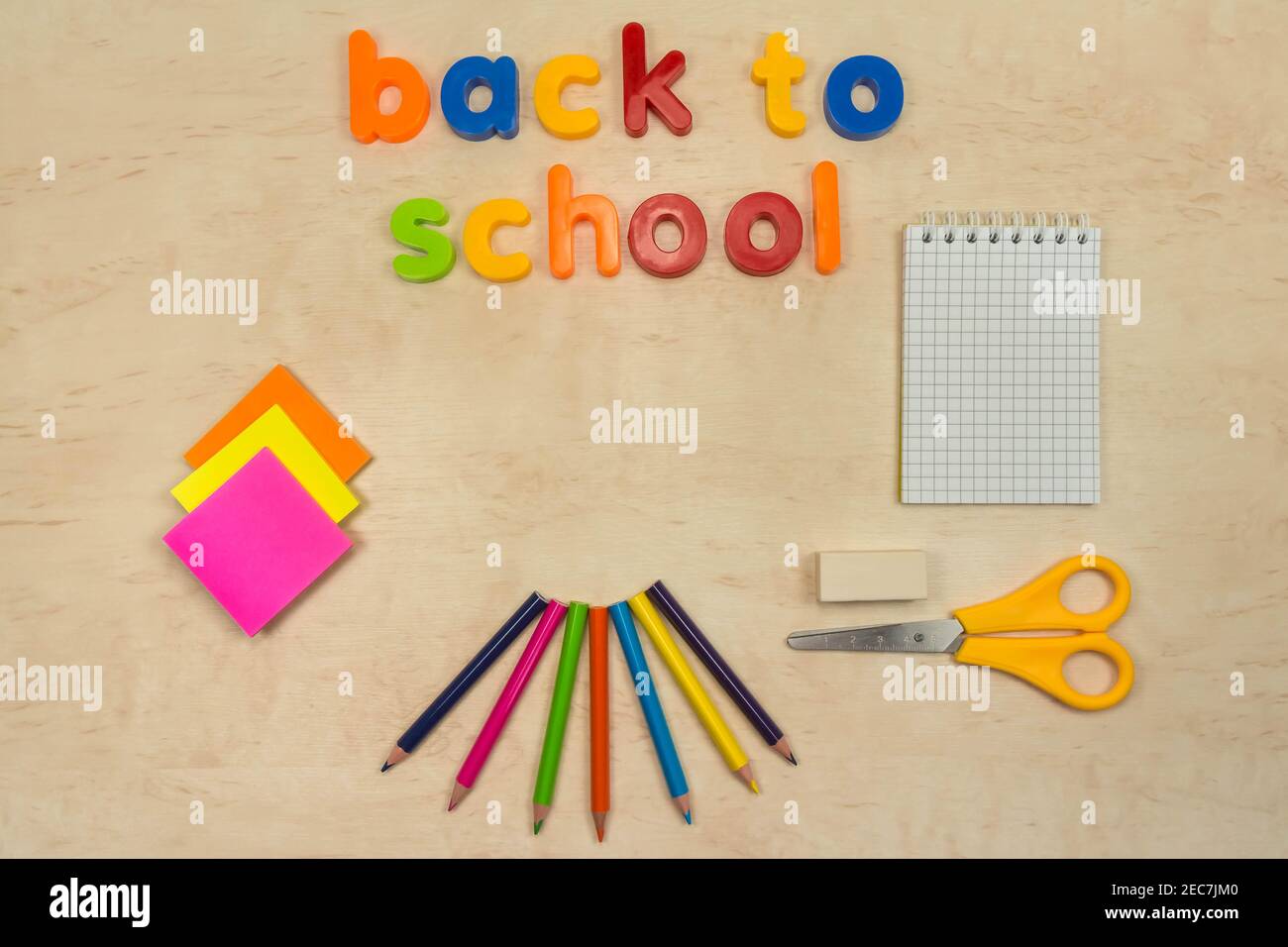 Back to school concept. Flat lay of wooden background with text of ...