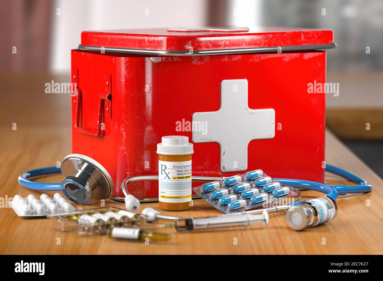 Open first aid kit with stethoscope, pills and smedicationon the table ...