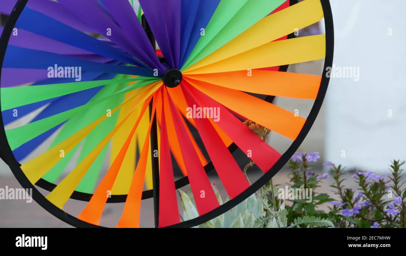 Colorful pinwheel spinning, weather wind vane, garden decoration in USA ...