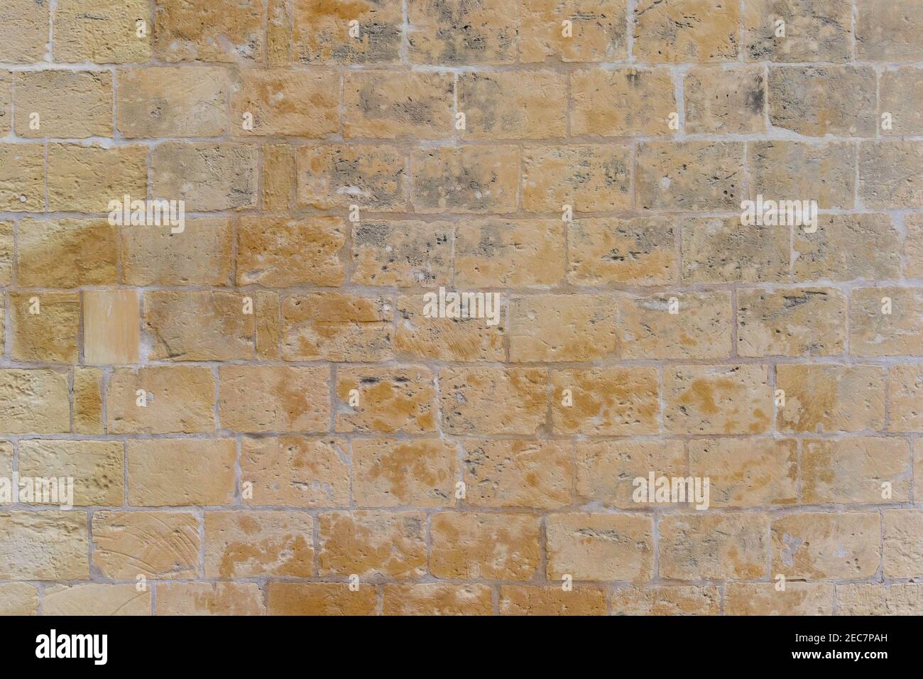 Masonry wall of ancient stone blocks of limestone. Background texture ...