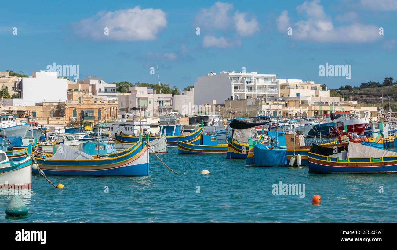Traditional colorful Maltese boats luzzu. Fisherman village of Malta ...
