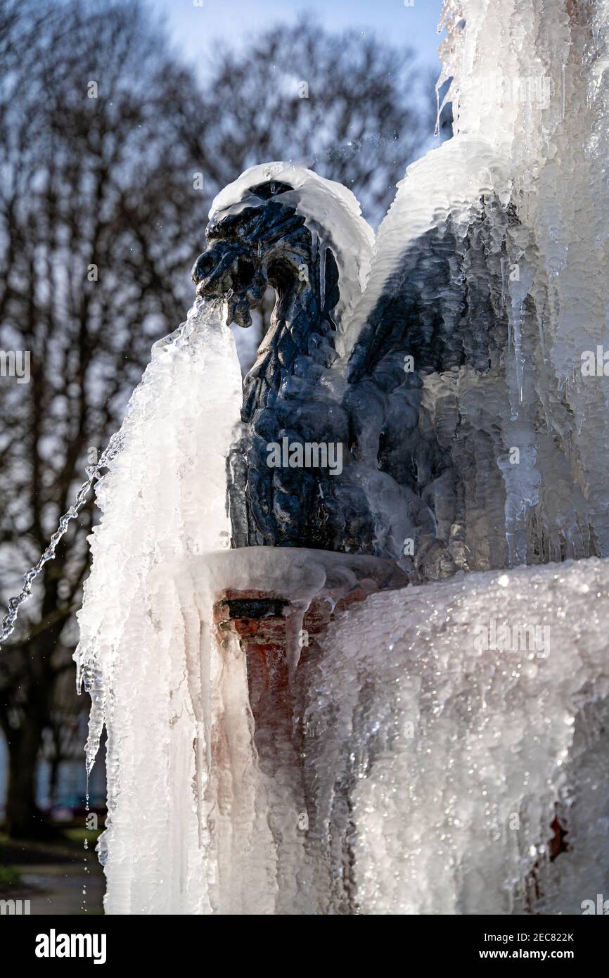 A frozen Victorian fountain in Hanley Park, featuring a sculpture of a ...