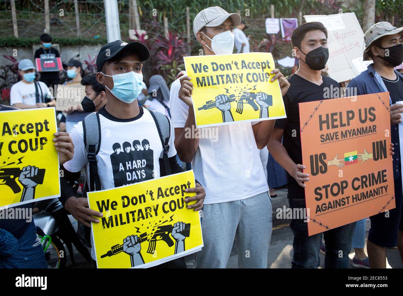 Protesters hold placards during the demonstration.Thousands of people ...