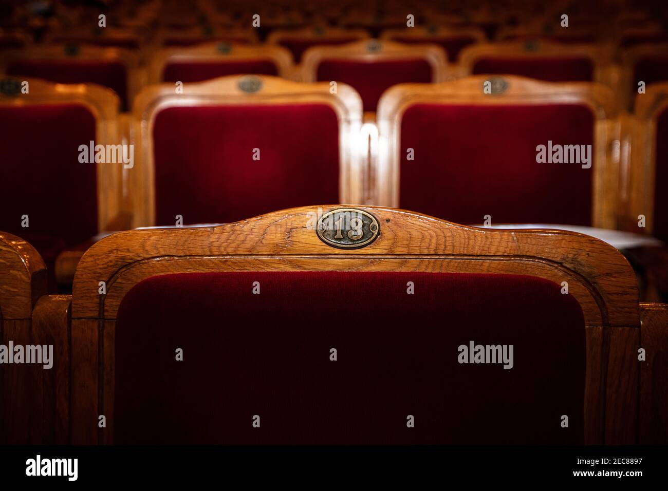 Row of red seats in theatre Stock Photo - Alamy