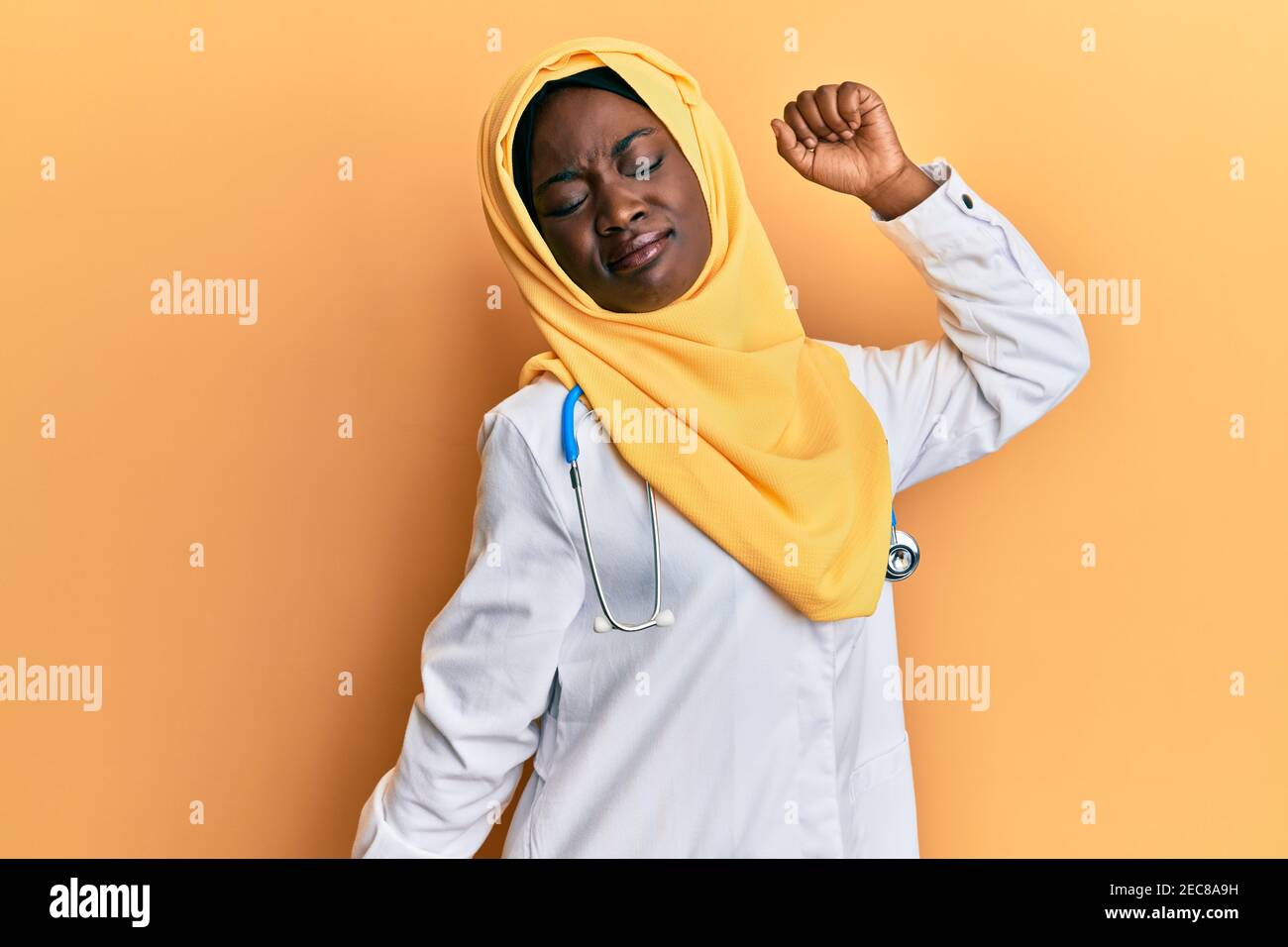 Beautiful african young woman wearing doctor uniform and hijab ...