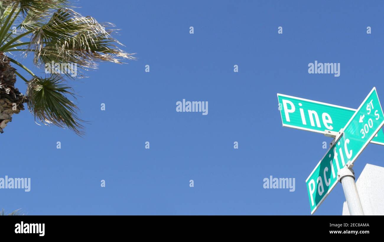 Pacific street road sign on crossroad, route 101 tourist destination ...