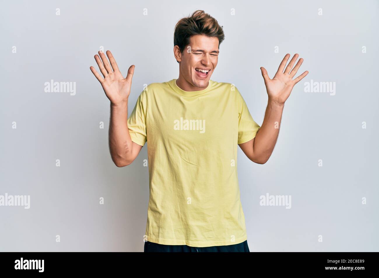 Handsome caucasian man wearing casual clothes celebrating mad and crazy ...