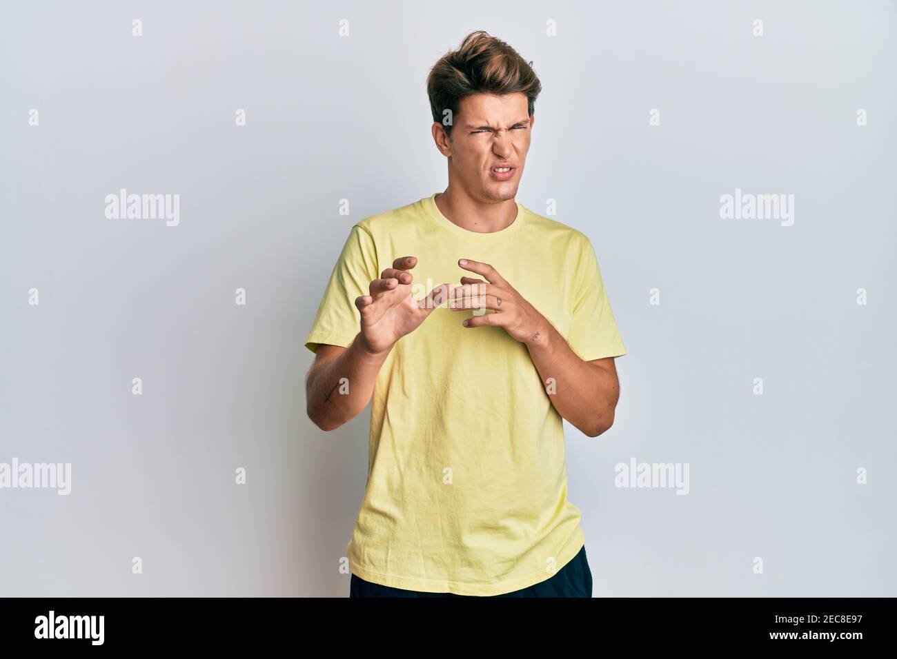 Handsome caucasian man wearing casual clothes disgusted expression ...