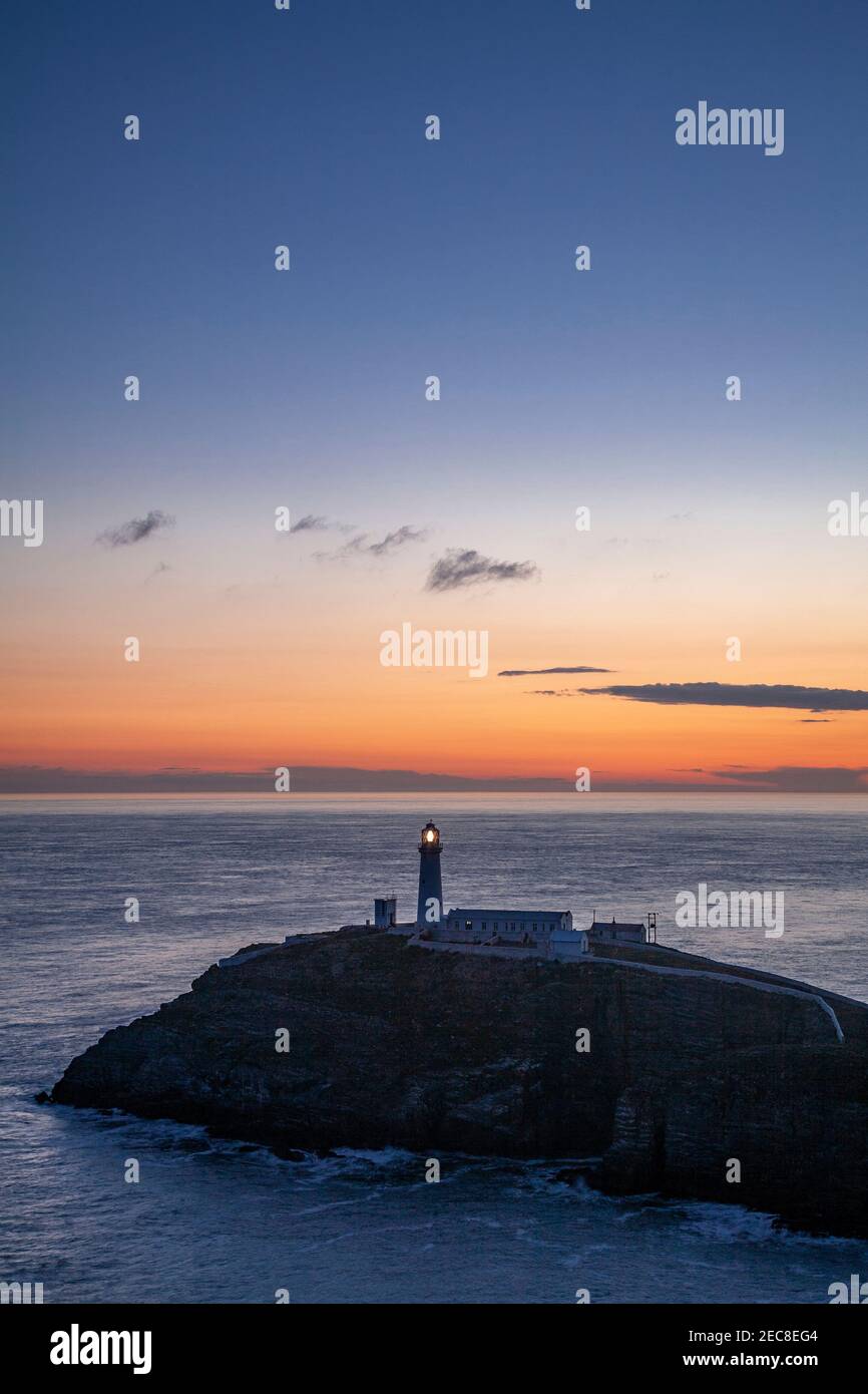 South Stack lighthouse at sunset, Anglesey on the North Wales coast ...