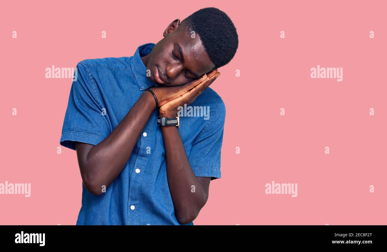 Young african american man wearing casual clothes sleeping tired ...