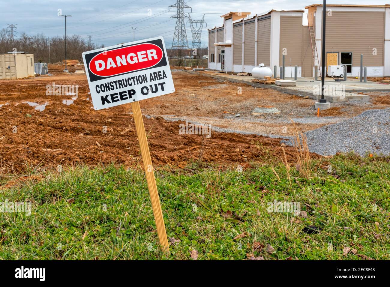 Horizontal shot of a Danger Construction Area Keep Out sign next to a ...