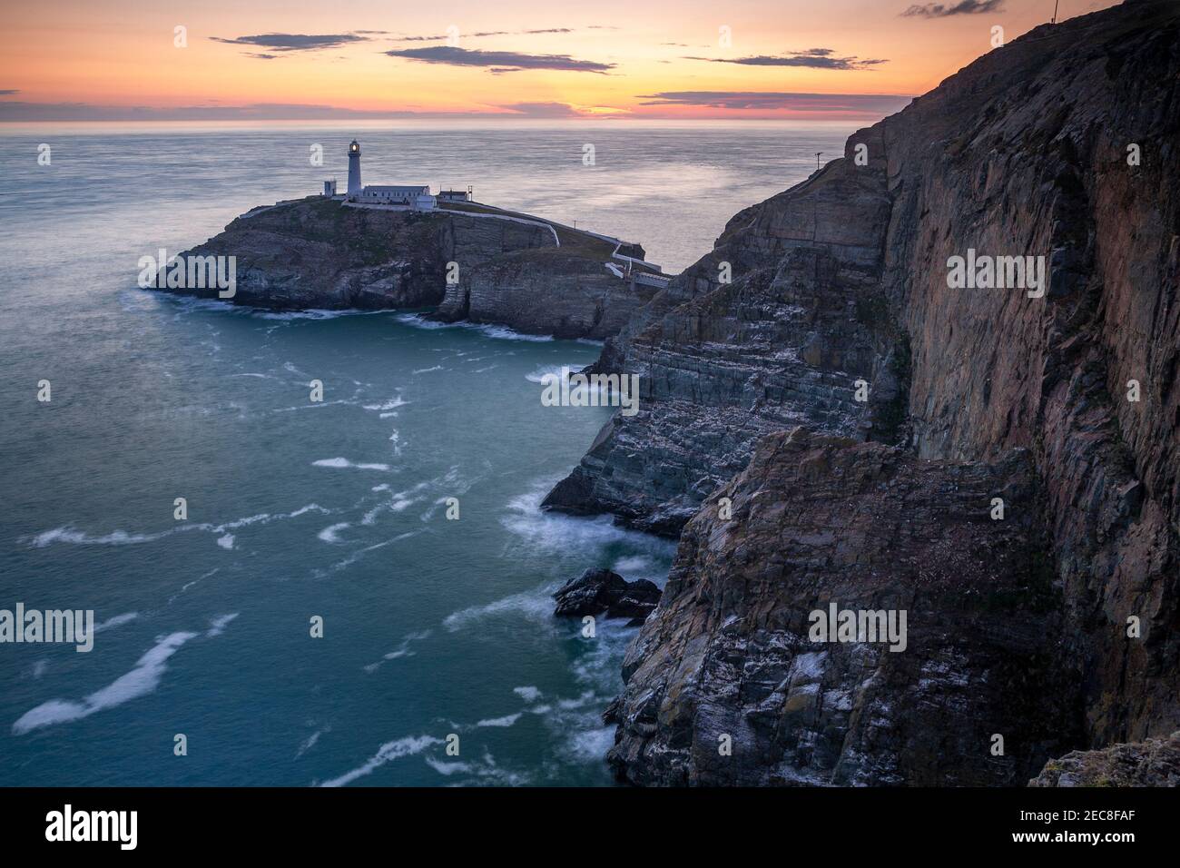 South Stack lighthouse at sunset, Anglesey on the North Wales coast ...