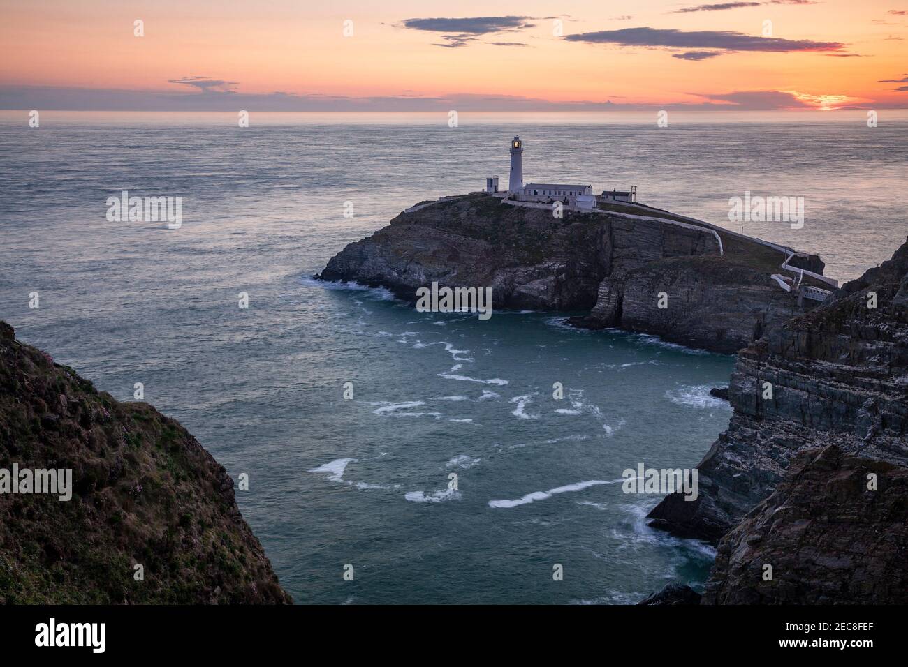 South Stack lighthouse at sunset, Anglesey on the North Wales coast ...