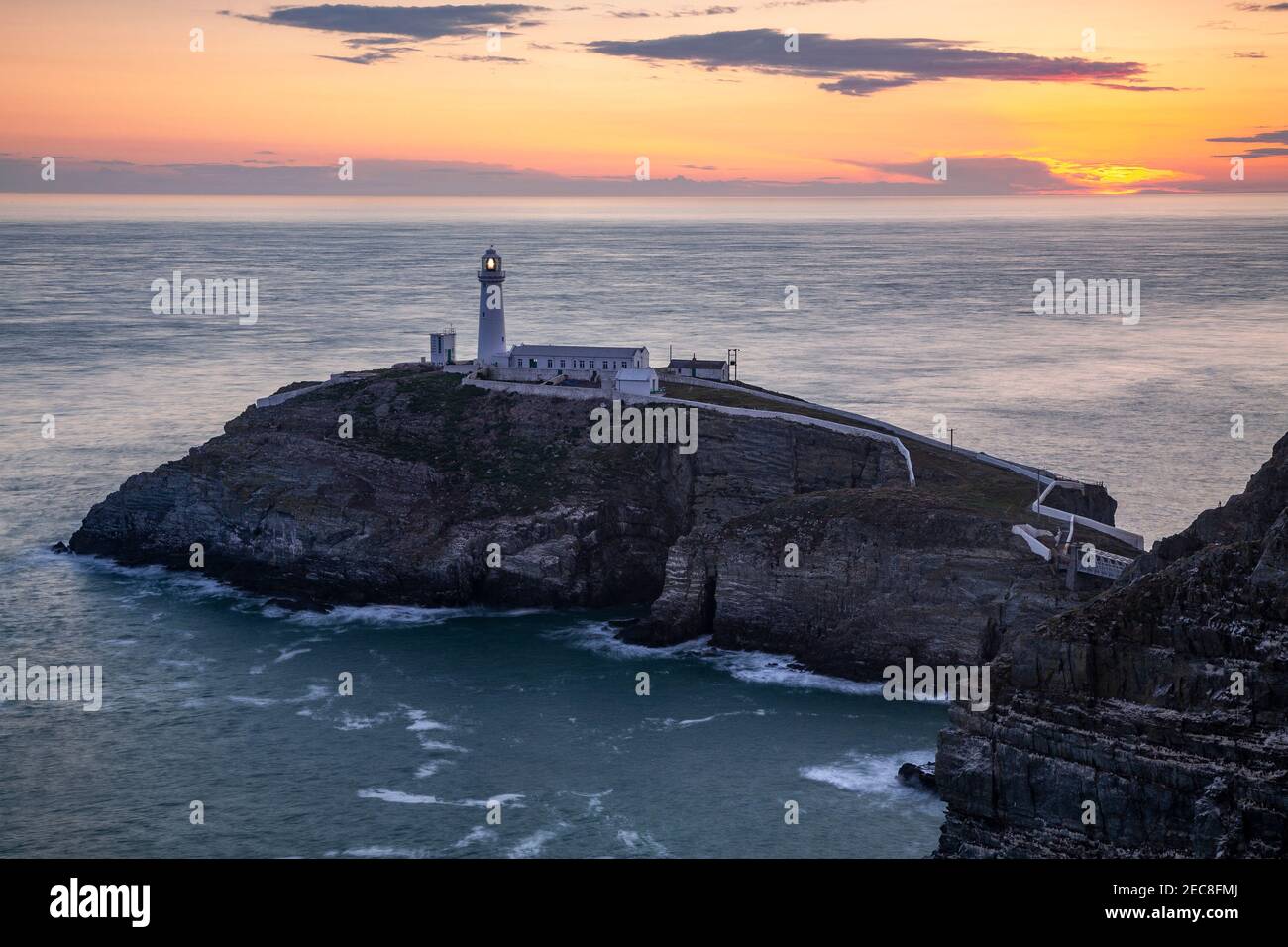 South Stack lighthouse at sunset, Anglesey on the North Wales coast ...