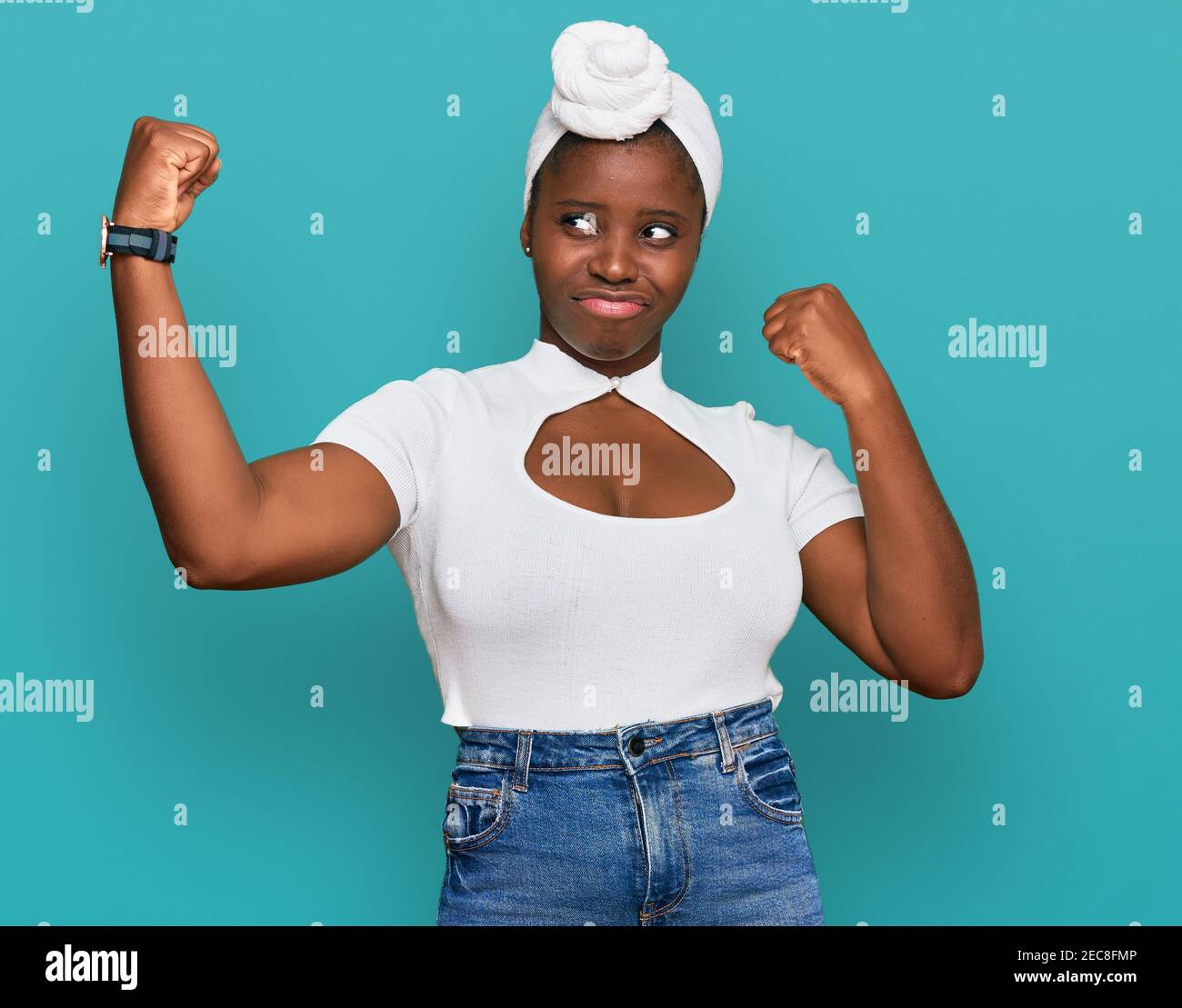 Young african woman with turban wearing hair turban over isolated ...
