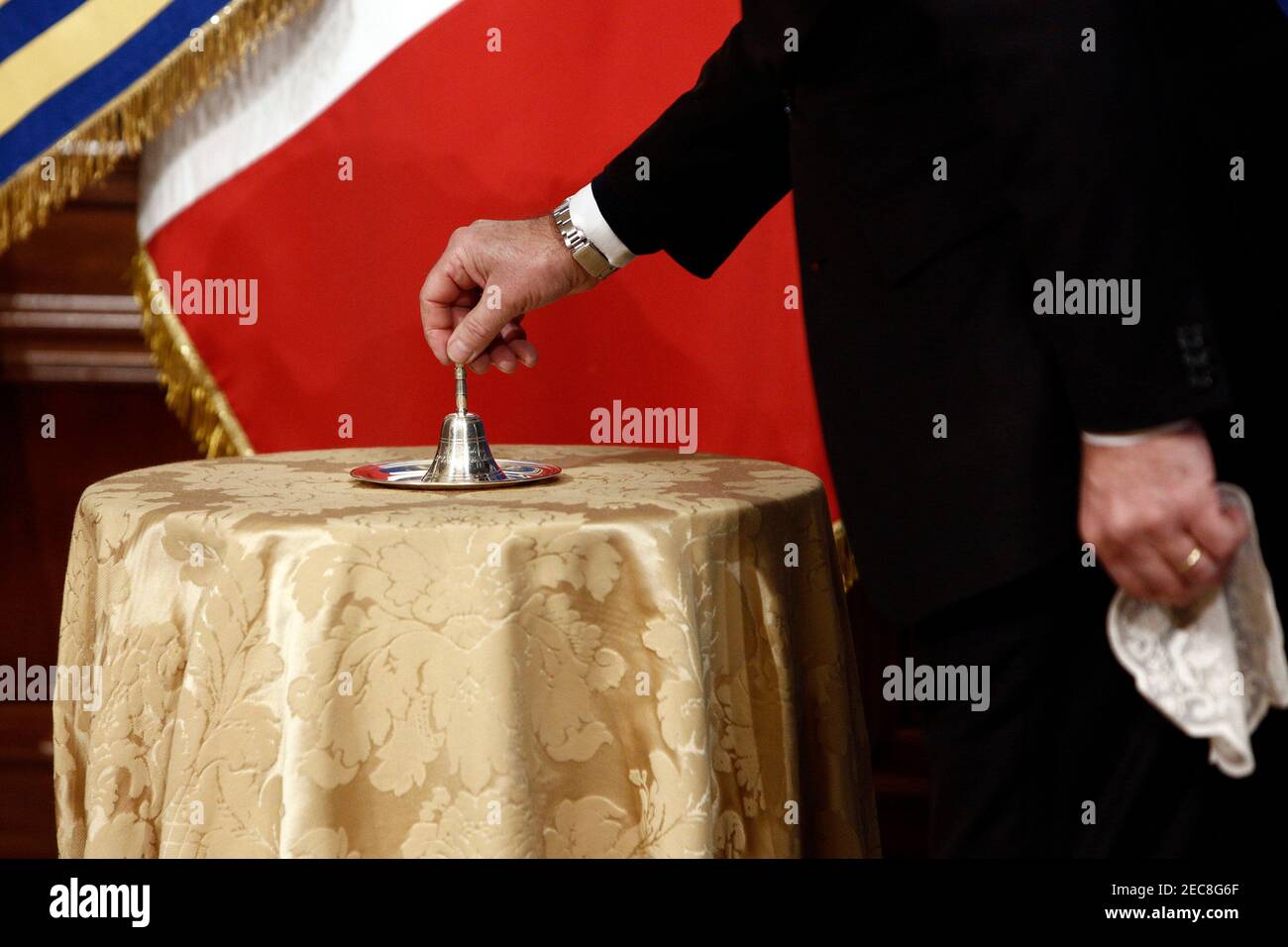 A clerk takes the bell during the traditional ceremony of the bell for ...