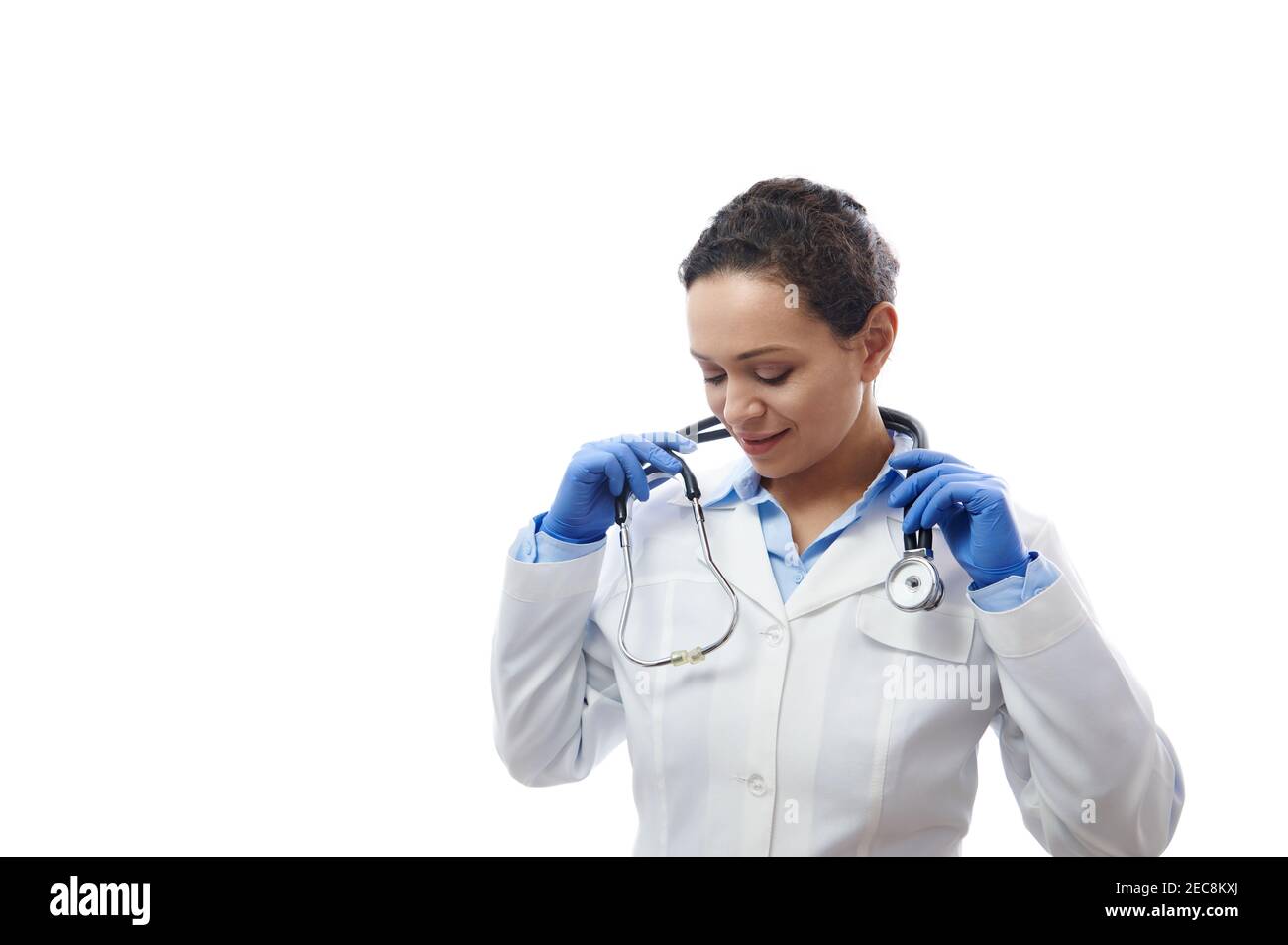 Doctor with stethoscope on his neck isolated on white background ...