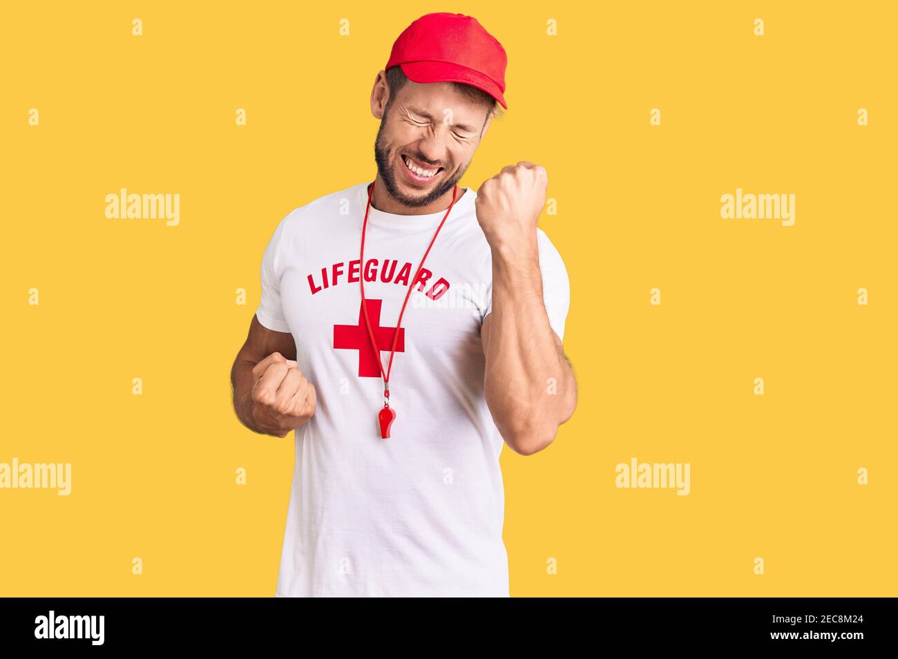 Young caucasian man wearing lifeguard t shirt holding whistle ...